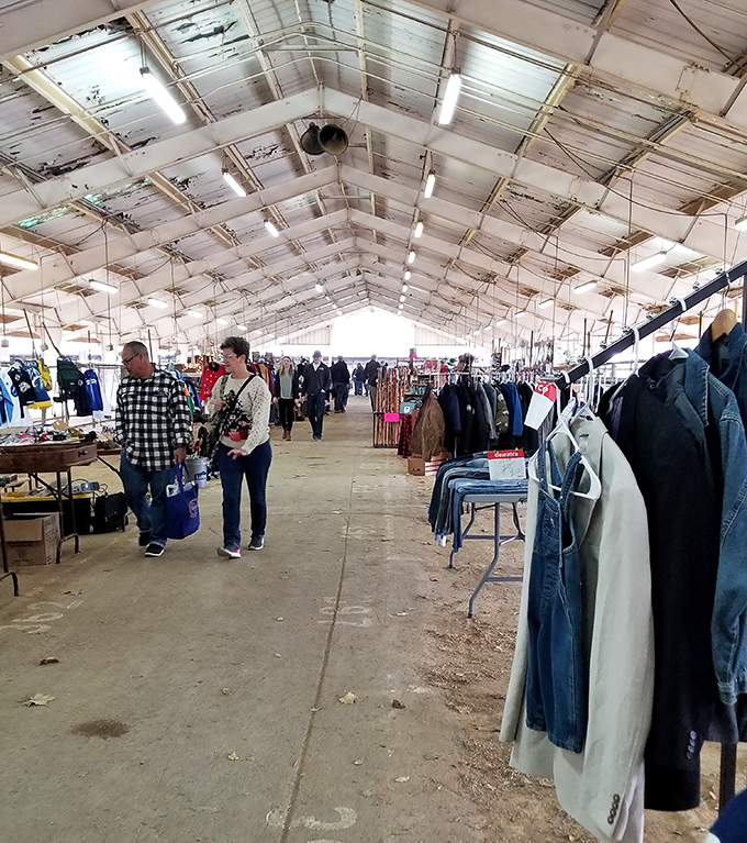 Under this white tent, yesterday's clothing finds new life with today's savvy shoppers browsing.