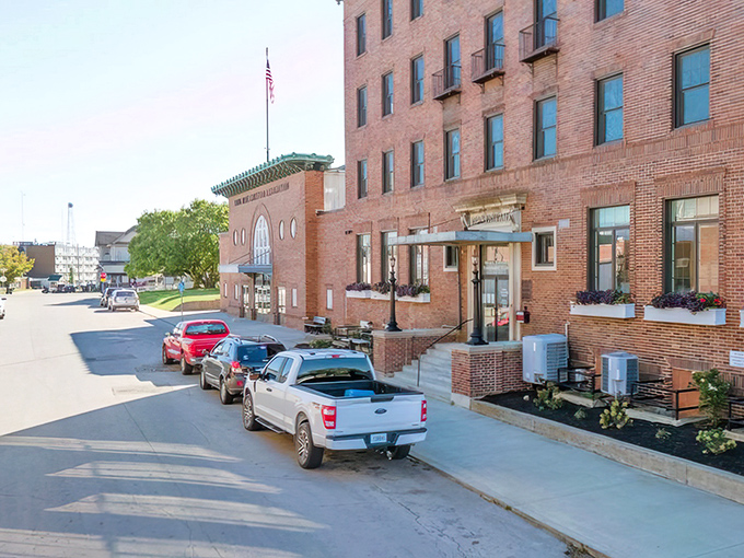 Small-town charm radiates from every corner where neighbors still wave and coffee costs reasonable prices.