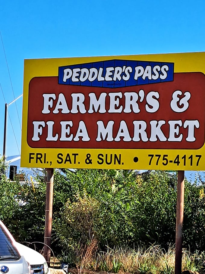 That friendly yellow sign welcomes weekend warriors to a farmer's market meets flea market adventure in style.
