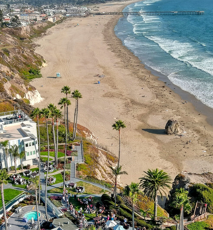 The golden shores of Pismo Beach meet the town's charming buildings – California coastal living at its most picturesque.
