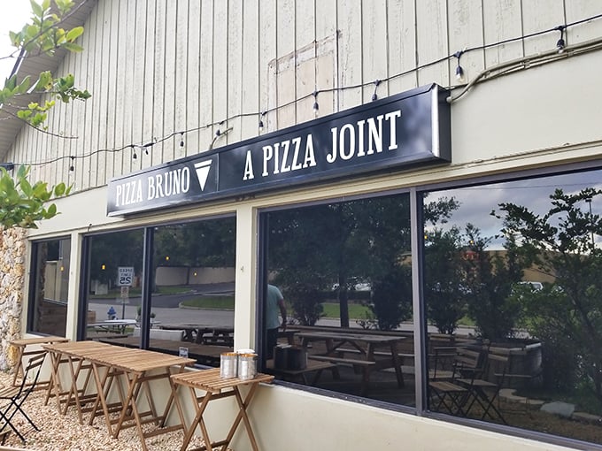 Sometimes the most understated exteriors house the most extraordinary pizza experiences waiting to be discovered.