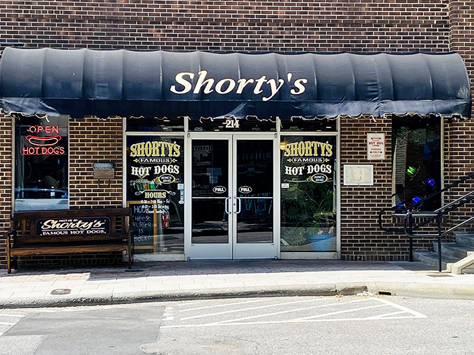 The welcoming entrance to Shorty's promises "Famous Hot Dogs" - a claim backed up by decades of satisfied customers and empty plates.