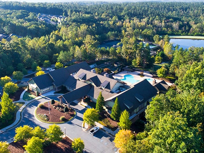 From this aerial view, the community center and pool create an oasis of leisure. Retirement's version of an all-inclusive resort!