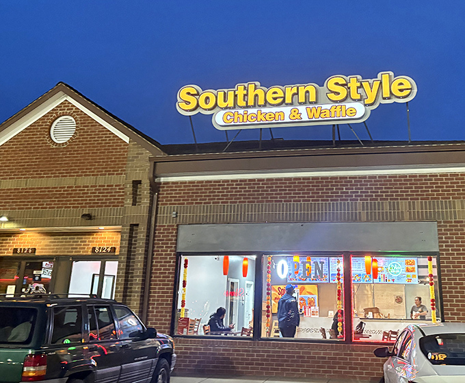 That glowing "OPEN" sign might as well say "happiness available here" &ndash; chicken and waffles never looked so inviting.