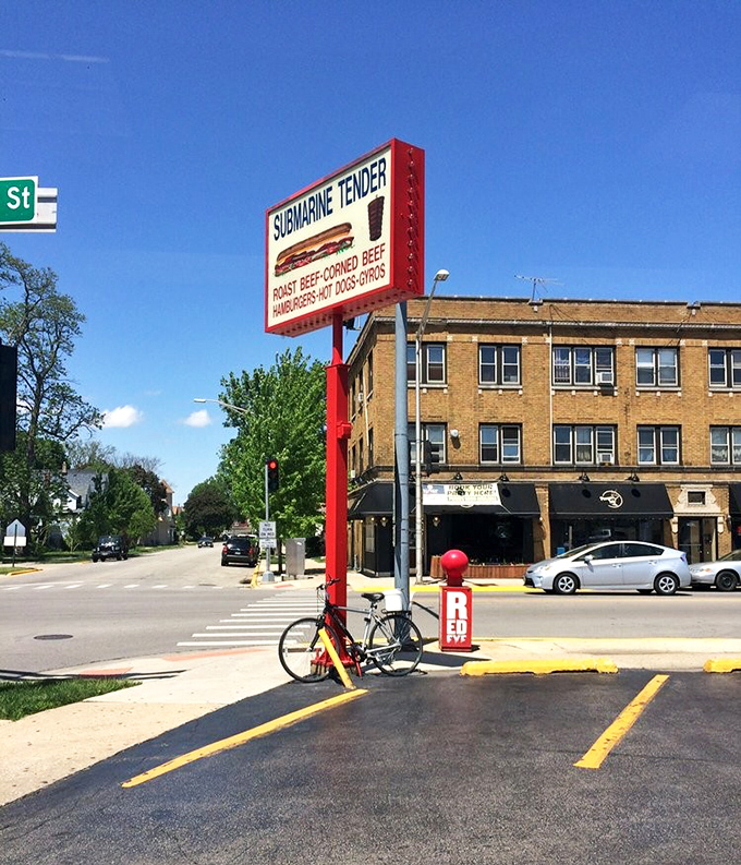 The towering red sign promises submarine sandwiches that could make Popeye weep with joy.