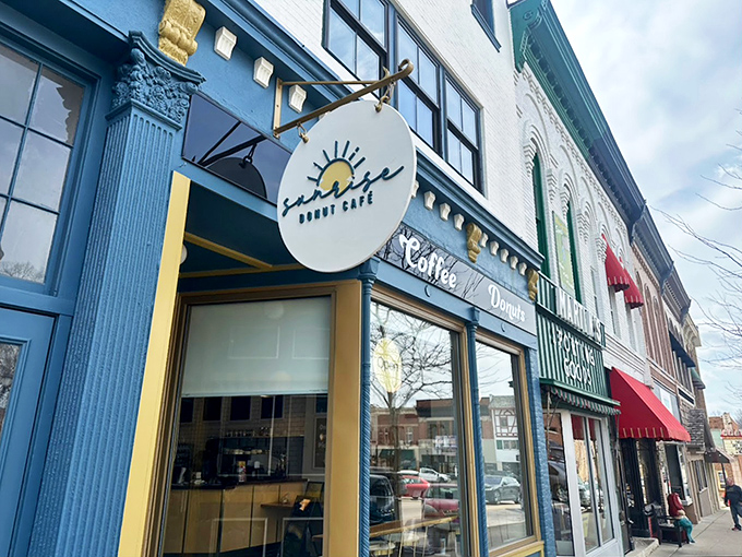 That welcoming entrance practically whispers "come in for coffee and stay for the donuts" in the most delightful way.