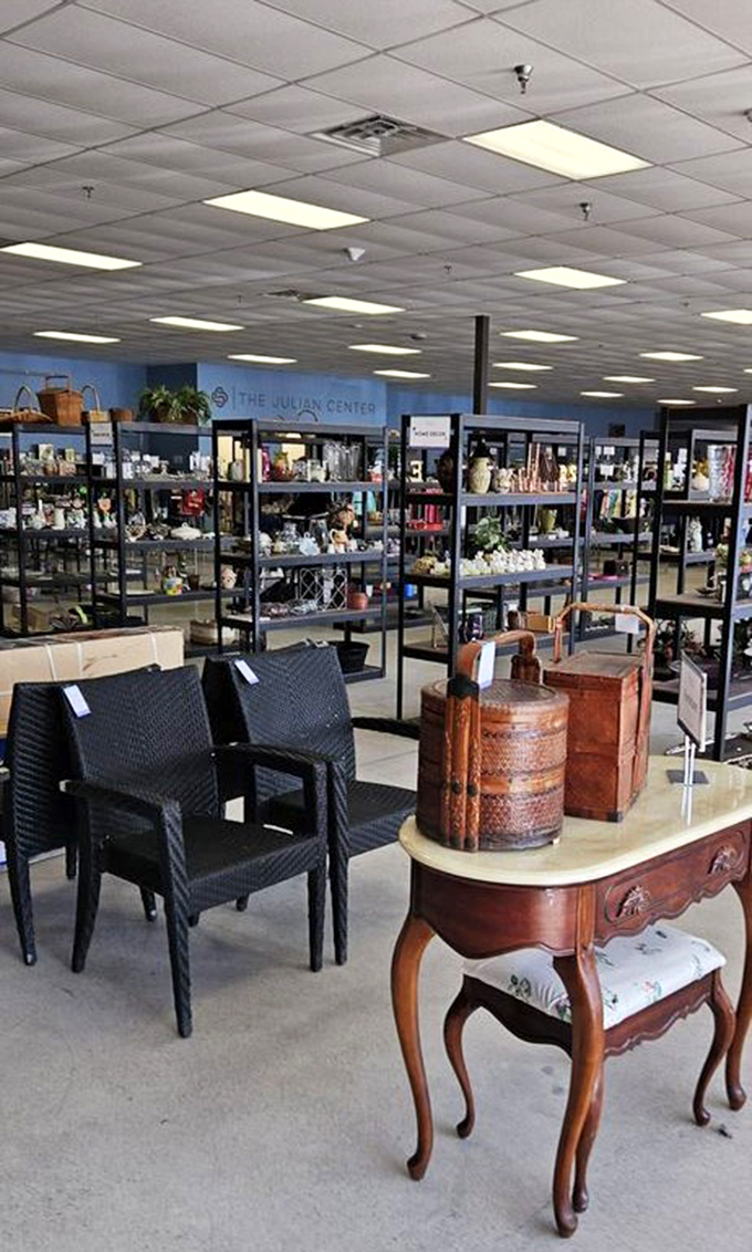 That welcoming interior glimpse reveals the clean, bright atmosphere that makes thrift shopping feel luxurious.