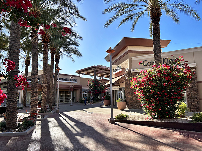 Palm trees frame this Tucson shopping haven where desert charm meets serious designer discount hunting.