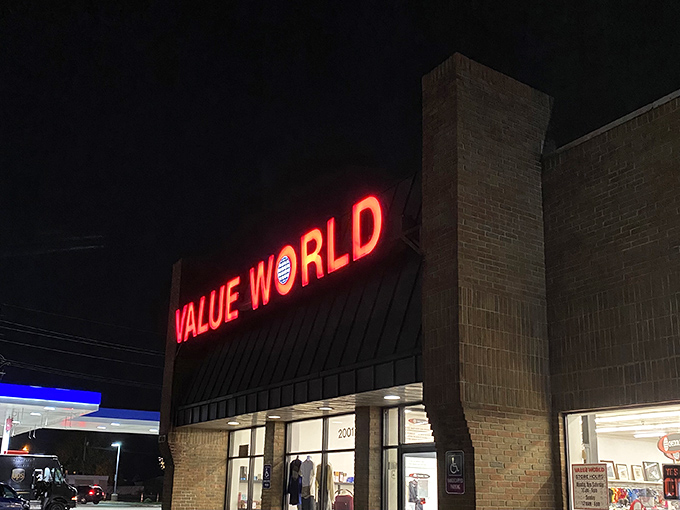 The neon sign glows like a lighthouse, guiding bargain hunters safely to shore through the night.