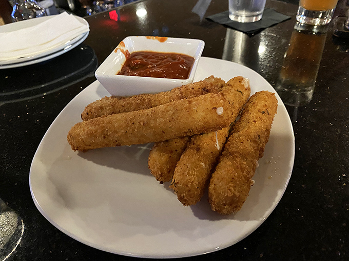 Mozzarella sticks that actually snap when you bite them! Crispy exterior, molten interior, and that marinara sauce &ndash; a perfect harmony of textures.