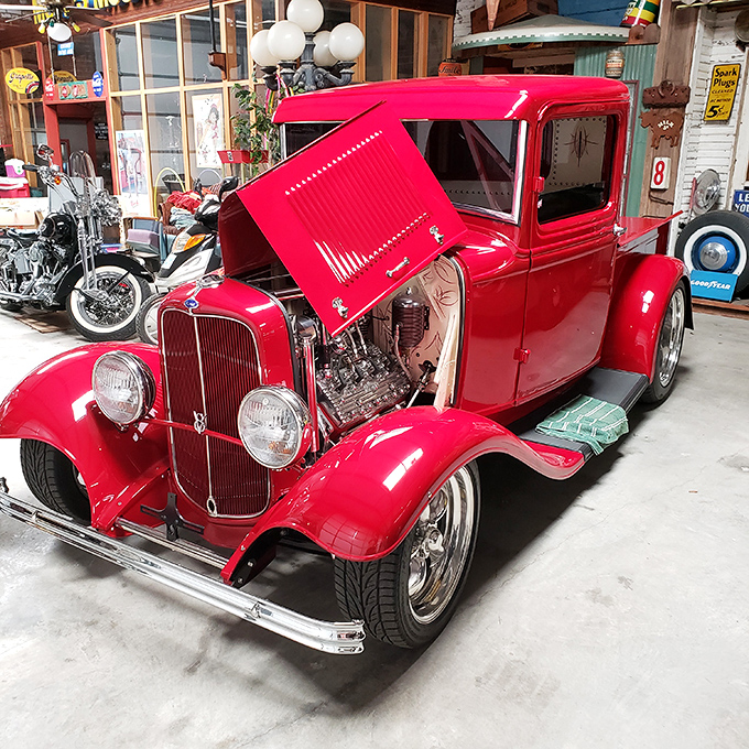 This cherry-red '32 Ford hot rod gleams with the kind of perfection that makes grown men whisper and car enthusiasts weak in the knees.