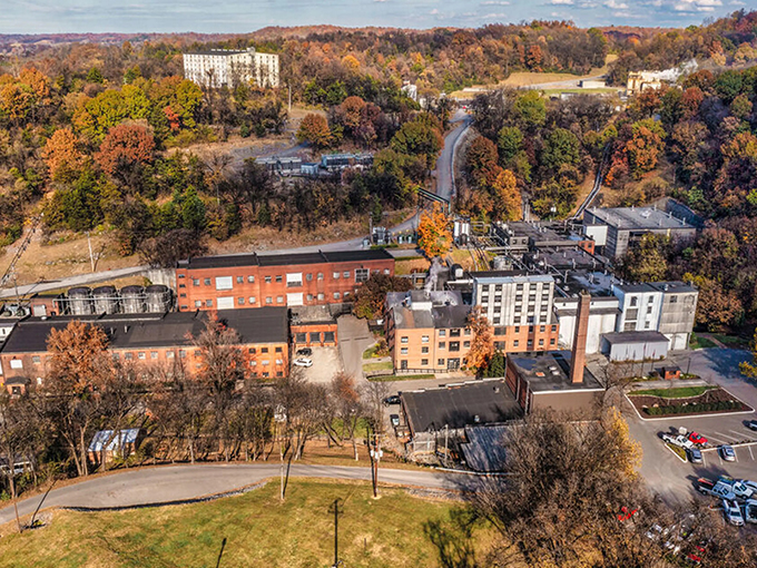 From above, Jack Daniel's Distillery reveals its industrial beauty. The brick buildings and surrounding autumn foliage create a perfect Tennessee tableau.