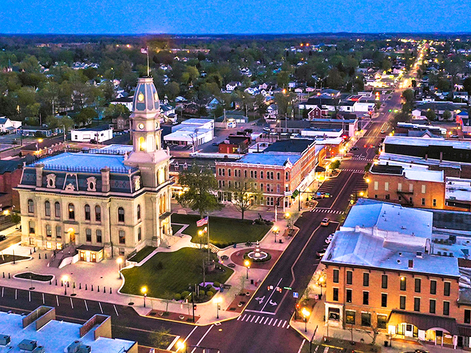 As twilight embraces downtown Bellefontaine, the courthouse stands illuminated like a beacon, reminding us that small towns often shine the brightest.