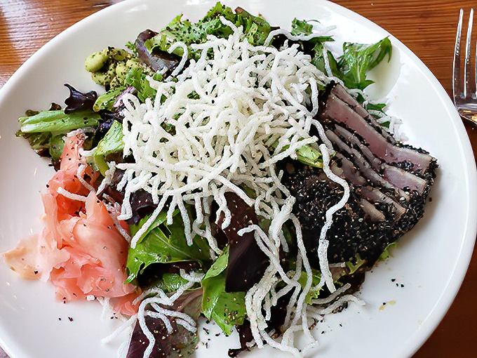 This ahi tuna salad isn't just healthy eating—it's edible art. Those crispy white strands add texture that makes your fork want to dive back in.