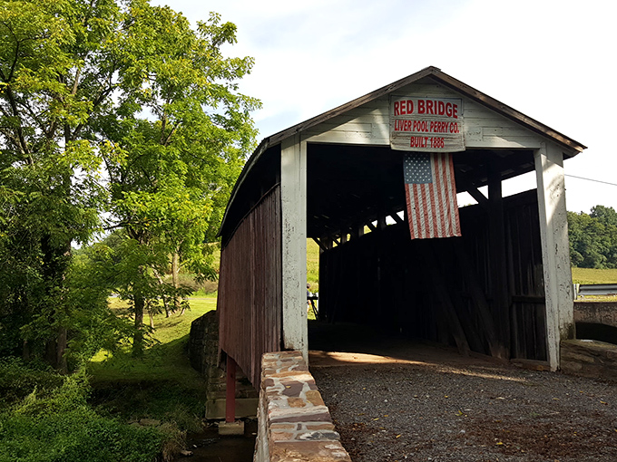 Nothing says "America" quite like a covered bridge proudly displaying Old Glory, welcoming visitors with patriotic charm.