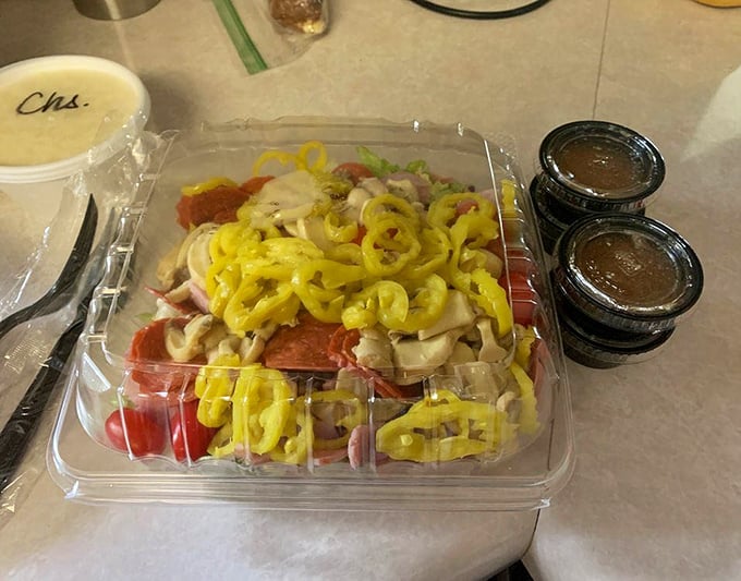 The antipasto salad &ndash; where banana peppers bring the zing to a party of meats and cheeses. Simple plastic container, complex flavors. 