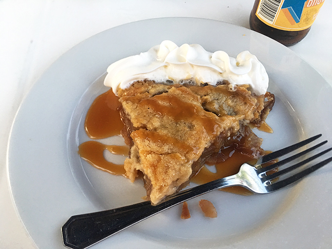 This isn't just apple pie&mdash;it's an edible time machine to your grandmother's kitchen, complete with caramel drizzle and whipped cream that refuses to take itself too seriously. 