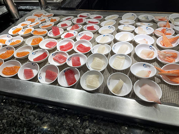 Fresh sashimi arranged like edible jewels, each piece more tempting than the last in those pristine little bowls.