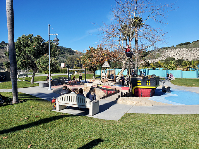 A playground where the ocean is the main attraction. Kids building sandcastles here are getting their first lessons in beachfront real estate.