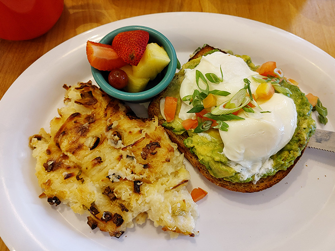Avocado toast elevated to an art form. That poached egg perched on top is just waiting for its Instagram moment.