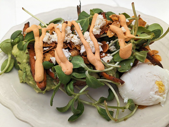 Avocado toast that puts your homemade version to shame. Crispy sweet potato, microgreens, and that sauce&mdash;oh that sauce&mdash;makes breakfast feel like a special occasion.