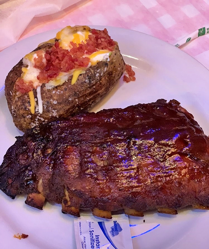 These ribs don't just fall off the bone—they practically jump into your mouth. The loaded potato is just showing off at this point.