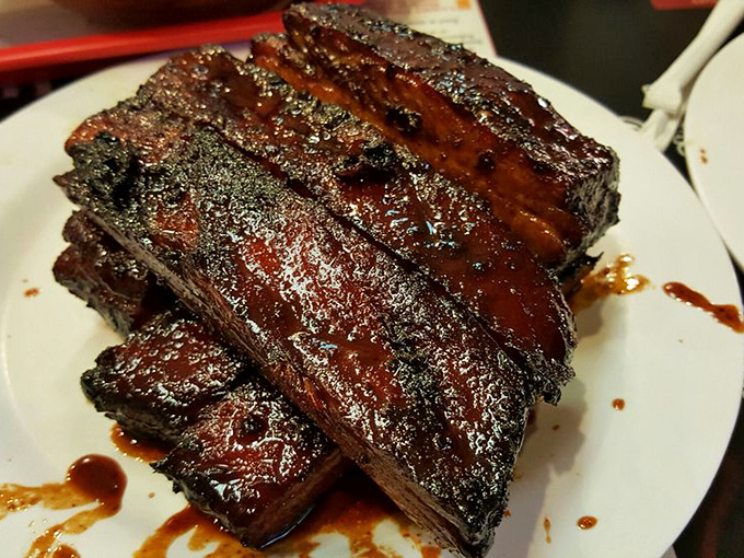 These ribs don't just fall off the bone&mdash;they practically leap into your mouth, glistening with sauce and sporting that perfect pink smoke ring.
