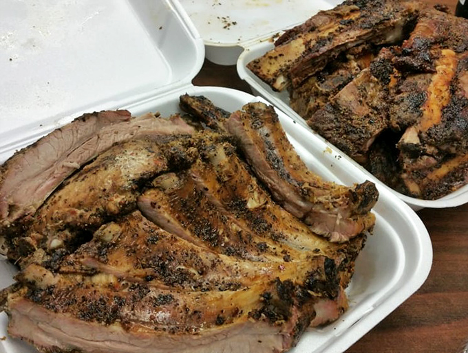 These baby back ribs aren't just falling off the bone—they're practically filing for independence. The bark alone deserves a standing ovation.