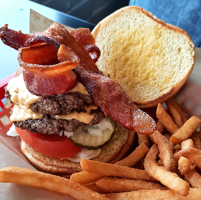 This isn't just a burger&mdash;it's architecture. The bacon practically needs its own zip code, and that cheese melt would make a cardiologist weep tears of professional opportunity. 