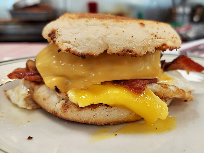 This breakfast sandwich isn't playing around&mdash;melted cheese cascades over bacon and egg on an English muffin like a sunrise worth waking up for.