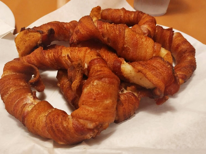 Bacon-wrapped onion rings: proof that sometimes the best ideas come from asking "what if we wrapped this in bacon?"