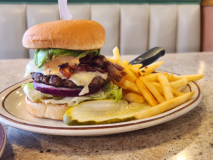 The burger that launched a thousand road trips. Perfectly stacked with bacon, cheese, and fresh veggies&mdash;this is architecture you can eat.