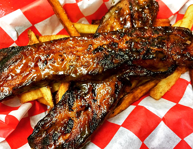 These aren't just ribs&mdash;they're edible evidence that patience is a virtue. The glistening bark and smoke ring tell tales of hours spent in smoky communion.