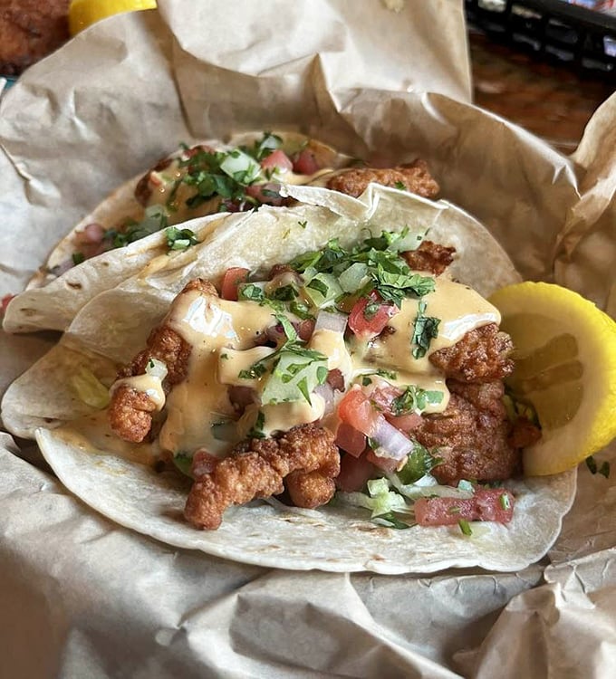 These Baja fish tacos deliver that perfect crunch-to-squish ratio with fried seafood, fresh toppings, and a sauce that ties everything together beautifully.