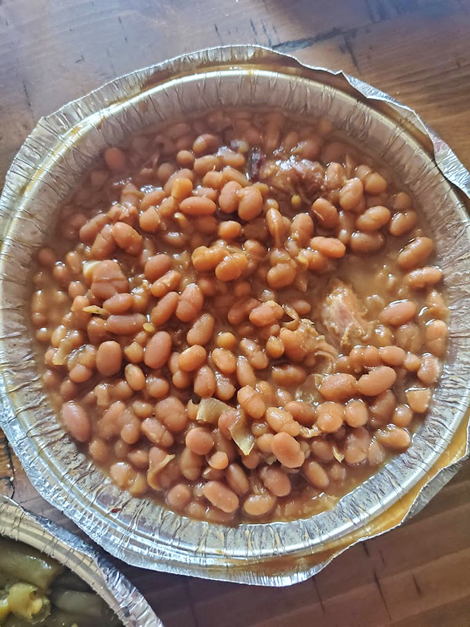 These baked beans have clearly been taking notes during the meat smoking process, absorbing flavors and making friends with bits of pork along the way.