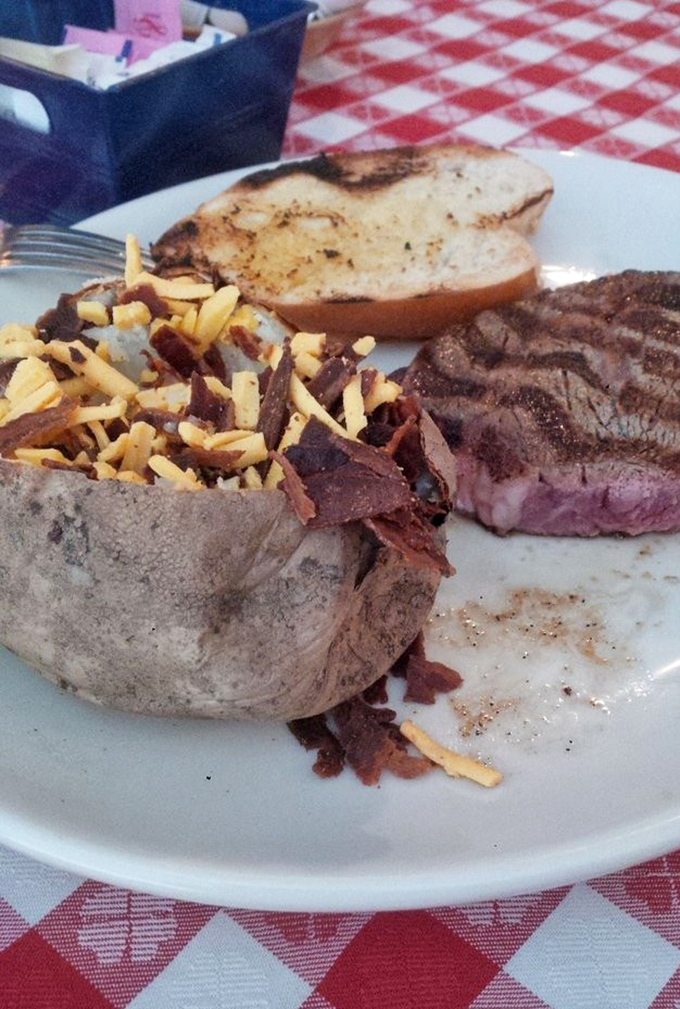 A loaded baked potato and medium-rare steak&mdash;the Fred Astaire and Ginger Rogers of comfort food, dancing perfectly together on a white plate.