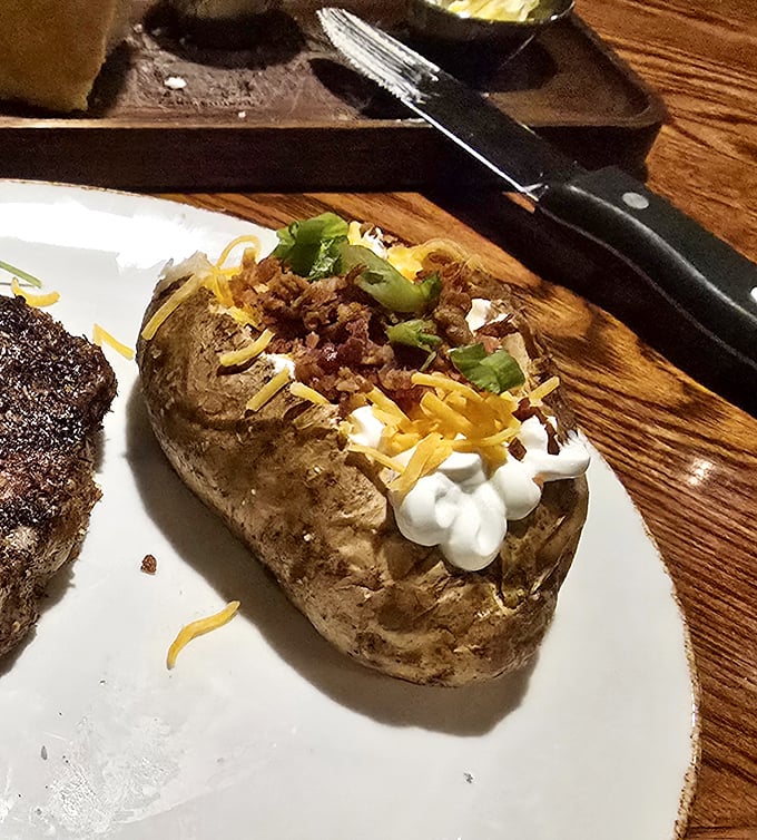 Not just any baked potato &ndash; a loaded masterpiece that's practically a meal itself. Cheese, bacon, and sour cream creating the holy trinity of potato perfection.