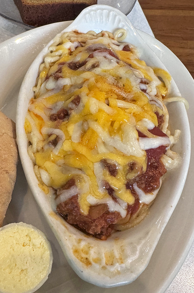 Cheese pulls for days! This baked dish showcases the universal truth that anything smothered in melted cheese instantly becomes 87% more delicious.