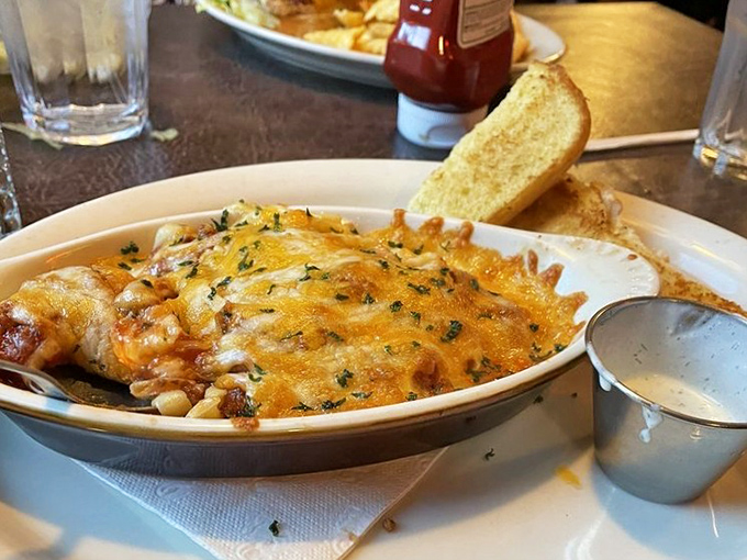 Cheese bubbling over pasta like molten gold &ndash; comfort food elevated to an art form without losing its soul-satisfying essence.