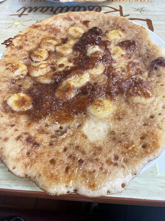 Banana pancake nirvana! Those caramelized fruit slices nestled in fluffy batter create the breakfast equivalent of hitting the lottery on your birthday.