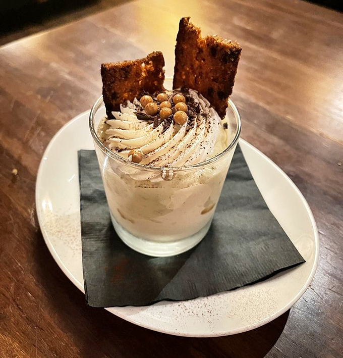 This banana tres leches dessert arrives looking like edible architecture, complete with toffee shards that could double as delicious roofing material.