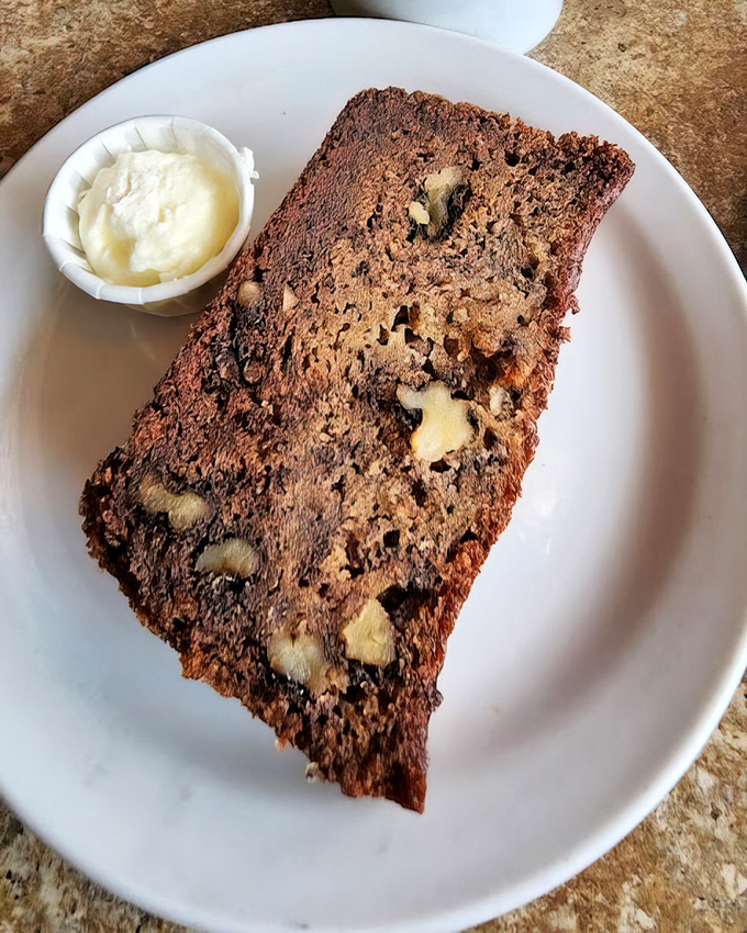 Banana walnut bread that would make your grandmother both proud and jealous. The butter cup isn't optional&mdash;it's essential to the experience.