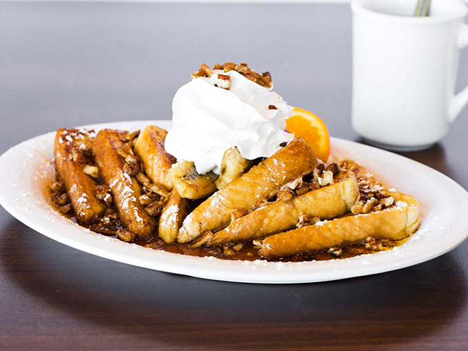 The Gone Bananas French toast doesn't just have bananas – it's a caramelized masterpiece topped with enough whipped cream to make your diet cry.