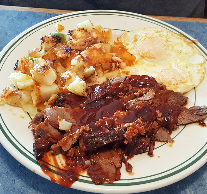 BBQ beef brisket with eggs and home fries &ndash; because sometimes breakfast needs to moonlight as dinner. The sauce alone deserves its own fan club.