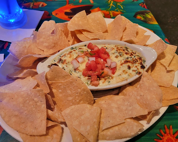 This spinach dip isn't just served with chips&mdash;it's presented like an archaeological discovery, surrounded by a tortilla chip excavation site.