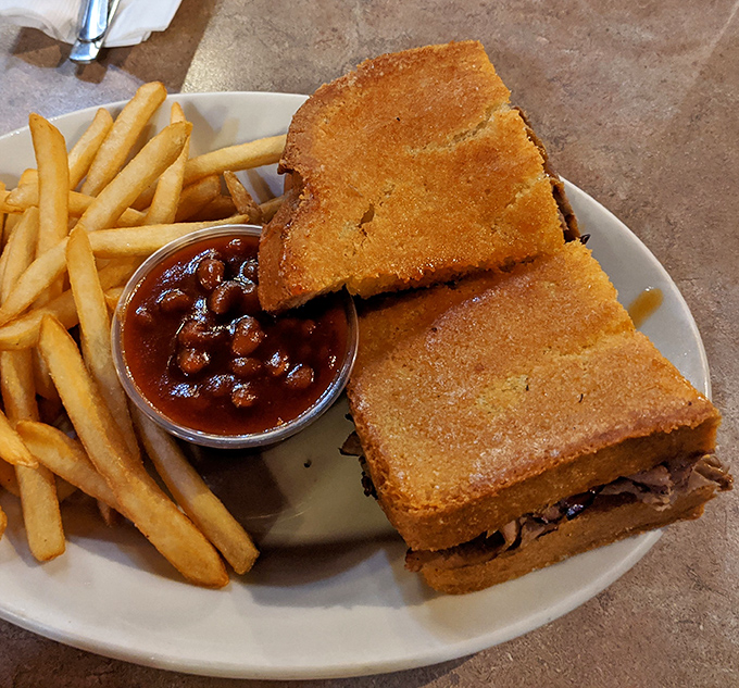 The sandwich that launched a thousand napkins. Golden-crisp garlic toast barely containing a generous heap of smoky meat&mdash;architecture that would make Frank Gehry proud.