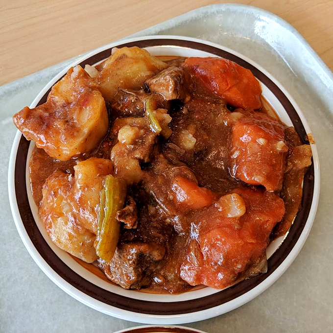 Comfort in a bowl: tender chunks of beef, potatoes, and carrots swimming in a rich gravy that could solve international conflicts.