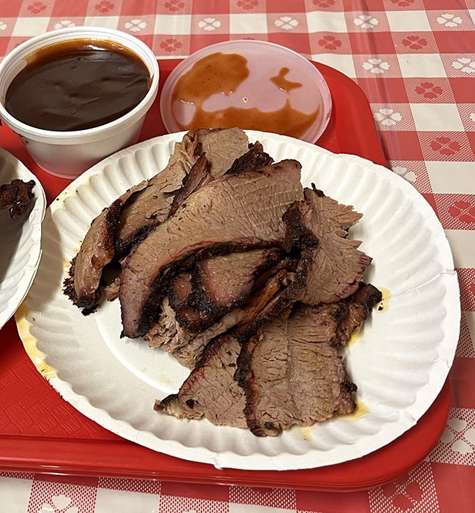Brisket so tender it makes you want to write poetry. That smoke ring isn't just pretty&mdash;it's a badge of honor in the barbecue world.