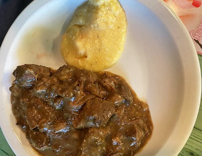 Beef tips swimming in gravy alongside a cornbread island—a geography lesson in deliciousness. This plate makes a compelling argument that heaven might be located in central Florida.