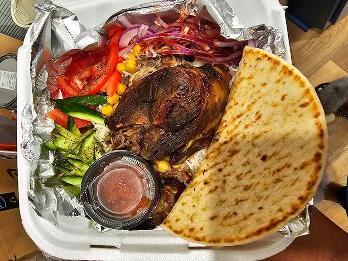 Slow-roasted meat that falls apart at the mere suggestion of your fork, served with fresh vegetables and warm pita. Food poetry!